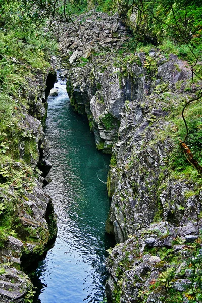 Takachiho Gorge, a narrow chasm cut through the rock by Gokase River ...