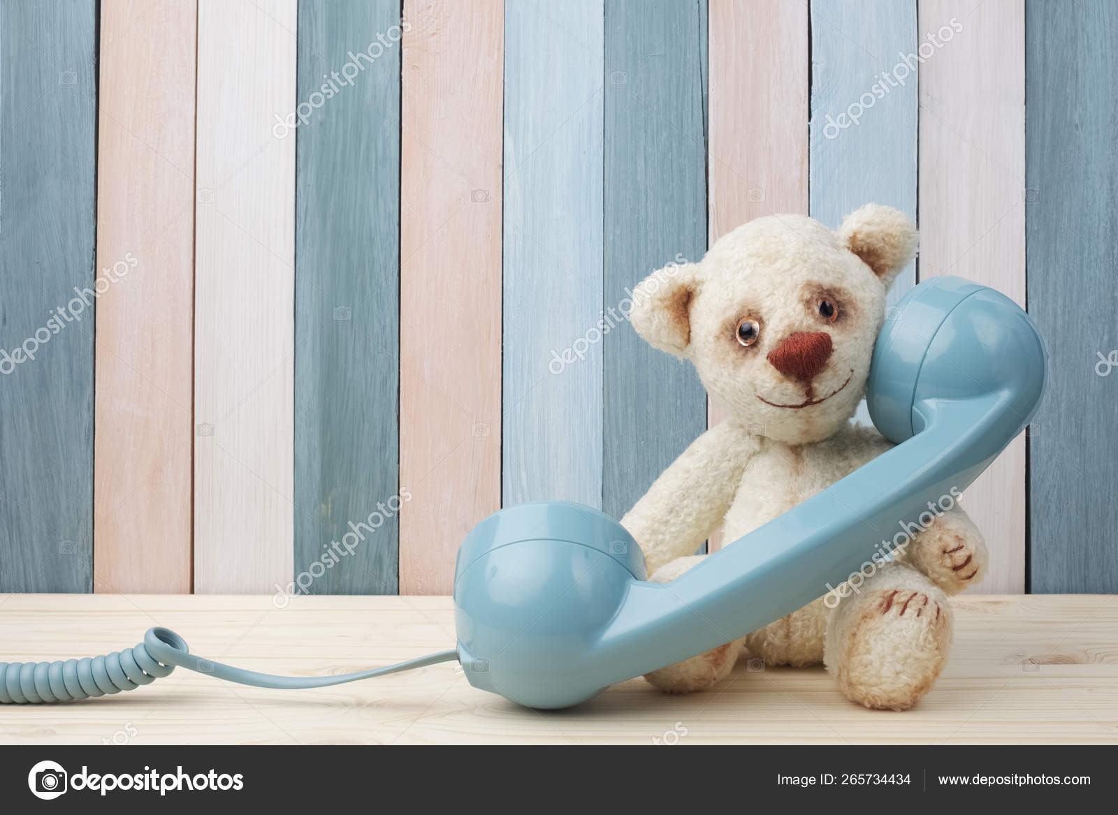 Vintage Teddy Bear with retro telephone on wooden background Stock ...