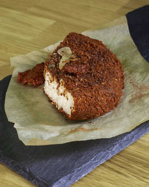 Goat milk ricotta cheese with spices and sun-dried tomatoes - Stock ...