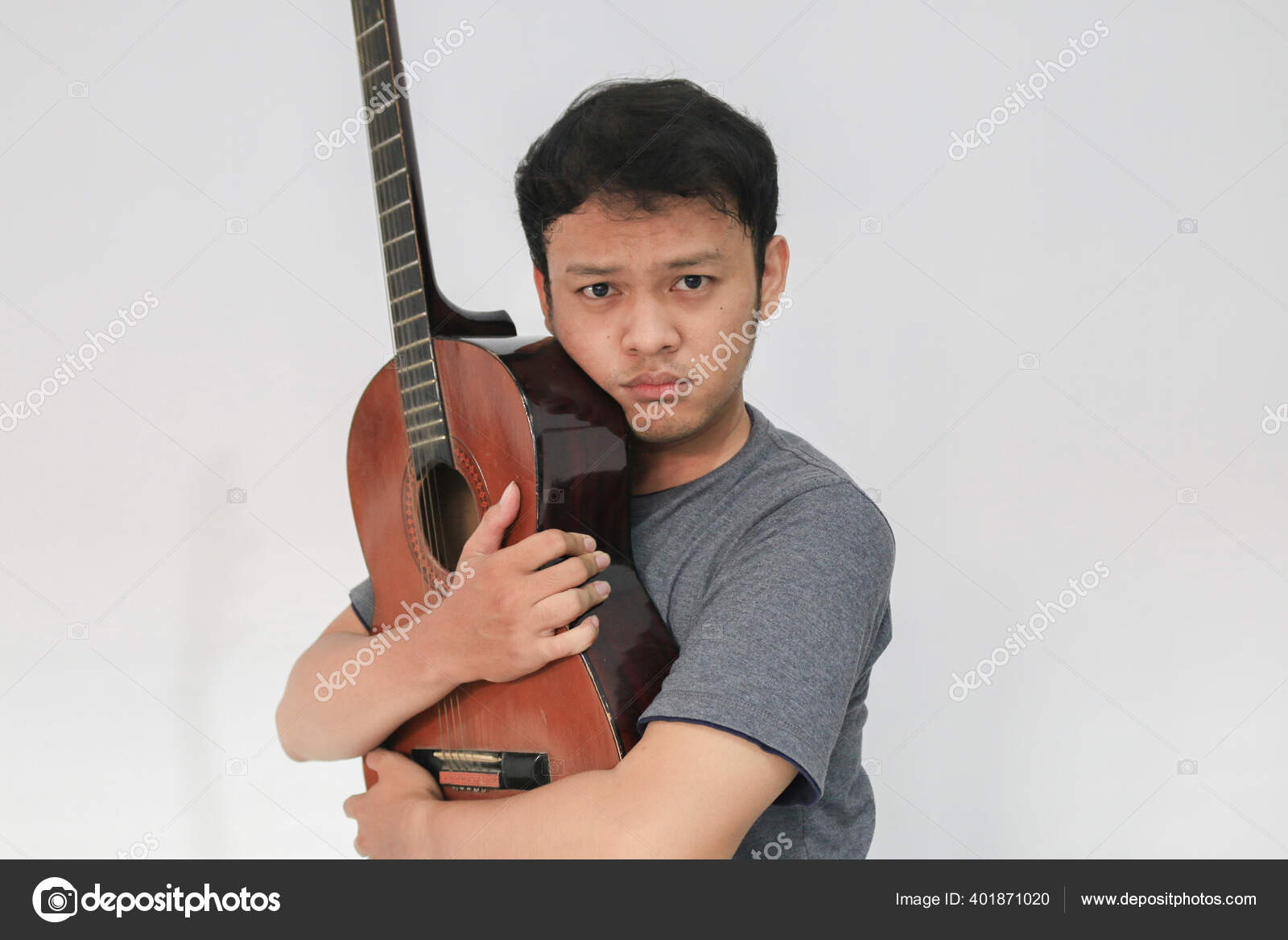 Young Asian Musician Who Sad Hugging His Guitar — Stock Photo ...