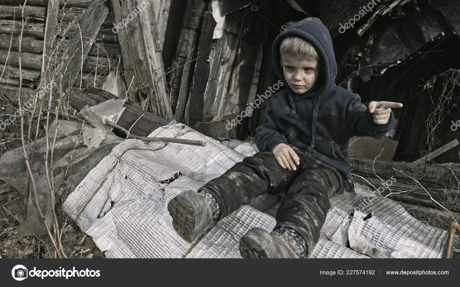 Sad Homeless Boy Sitting Abandoned Building Pointing Away — Stock Photo ...