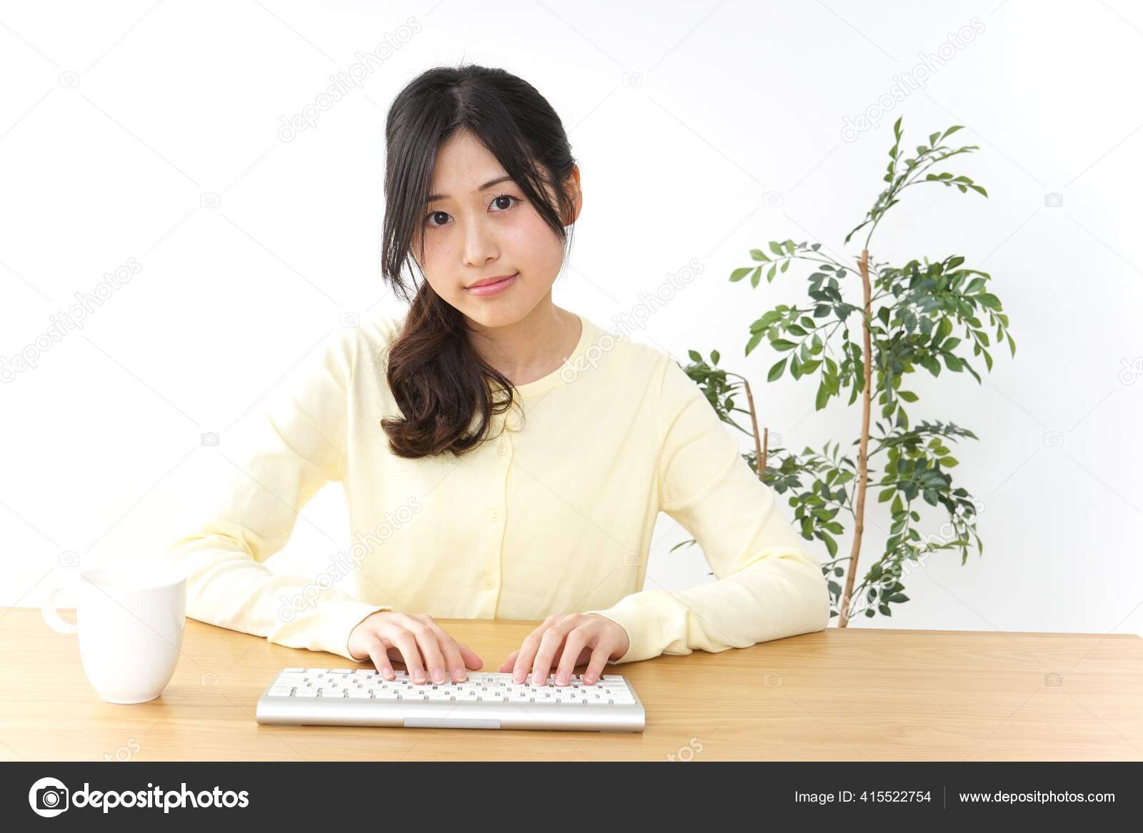 Asian Woman Using Computer — Stock Photo © maroke #415522754
