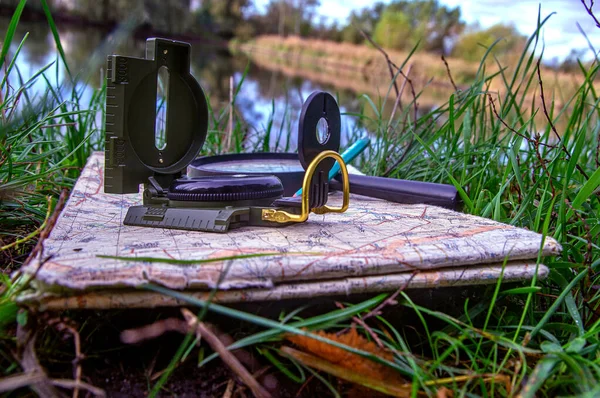 Ukraine, compass and map for travel navigation, photographed in natural ...