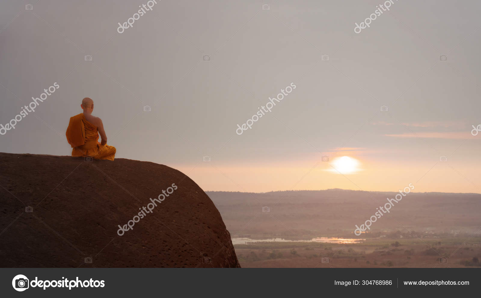Buddhist monk in meditation at beautiful sunset or sunrise backg Stock ...