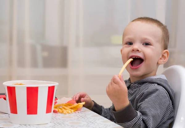 Kid eating fries Stock Photos, Royalty Free Kid eating fries Images ...