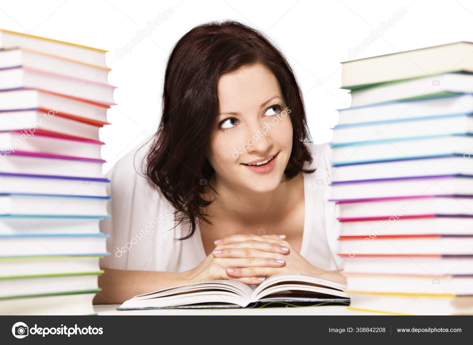 Girl between books stacks reading. Stock Photo by ©lichtmeister 308842208