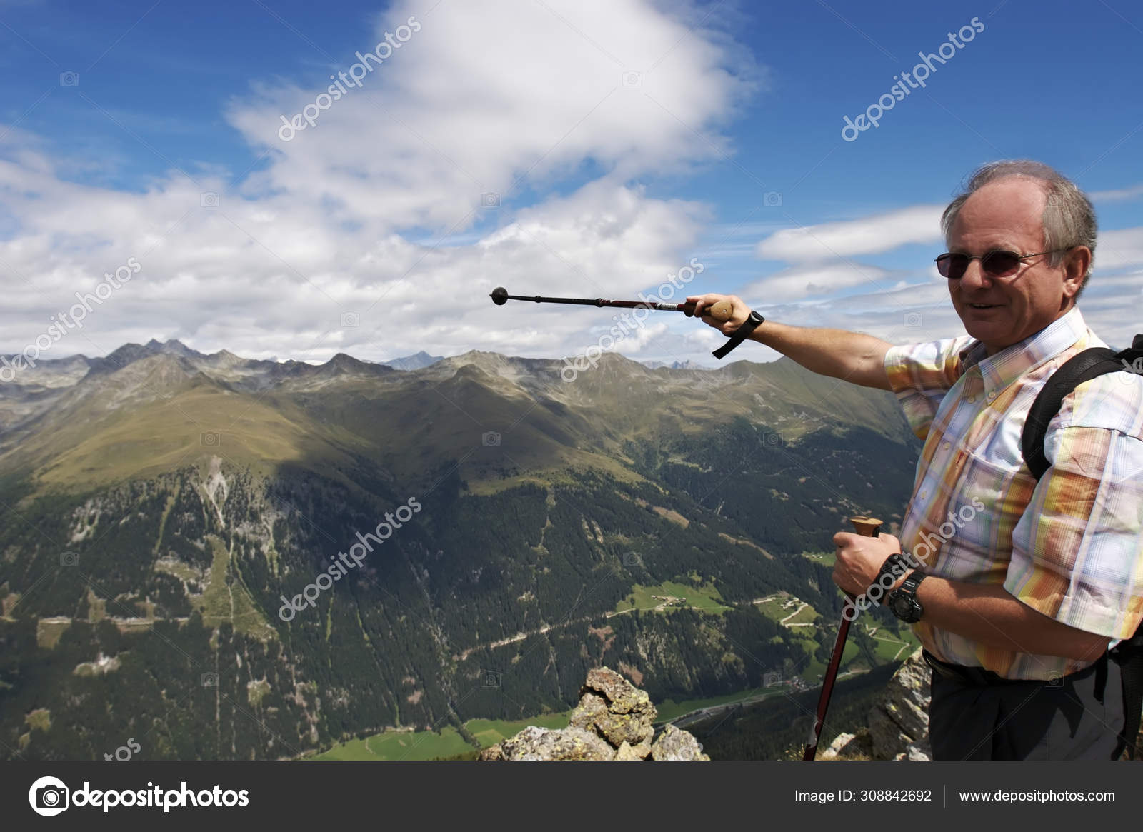 Pointing at wonderful landscape in the Alps Stock Photo by ...