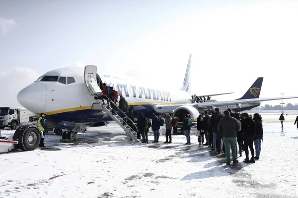 Airplanes on the runway are covered by snow during a snowfall at ...