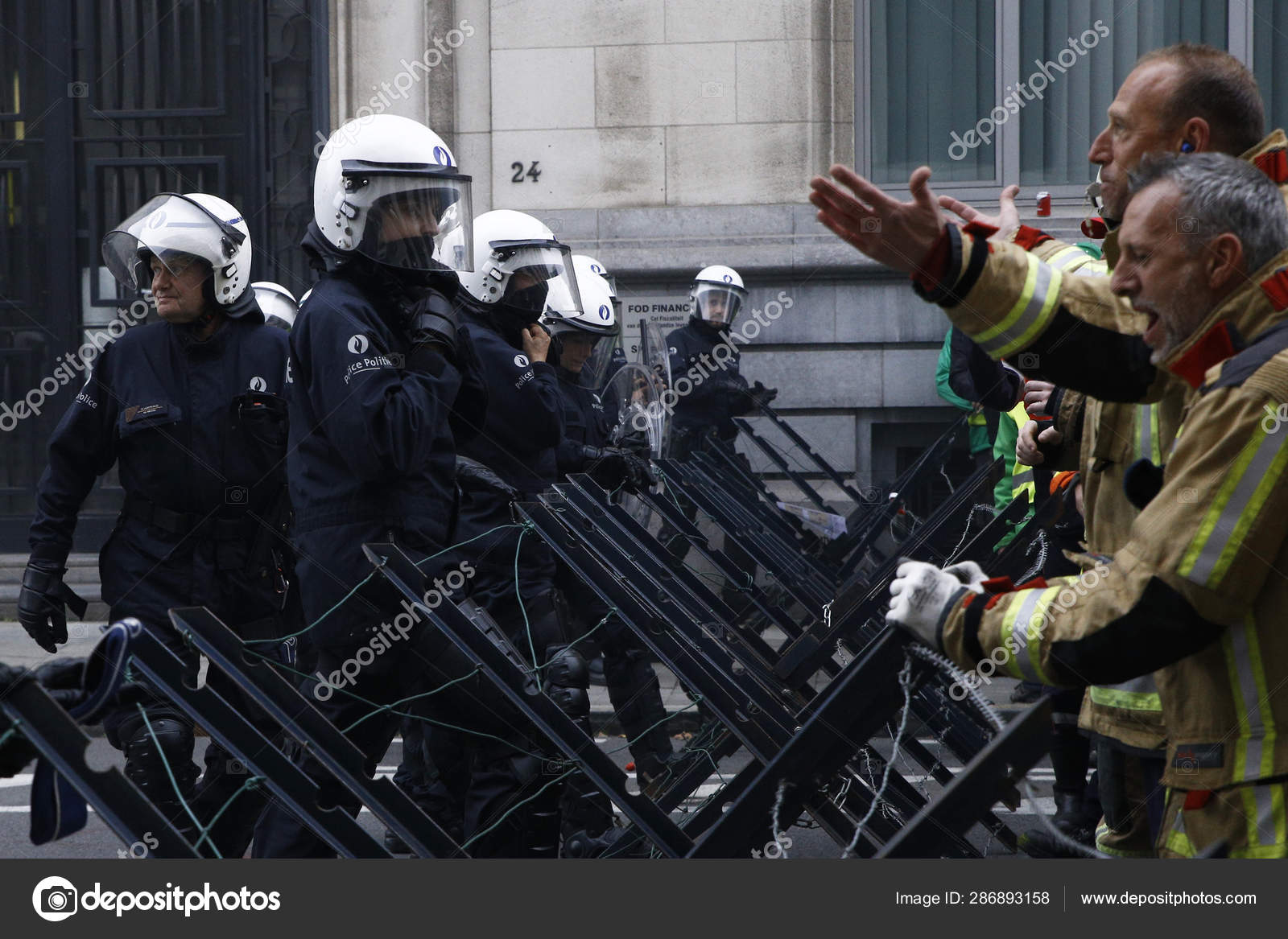 Firefighters and workers from public sector scuffle with riot po ...