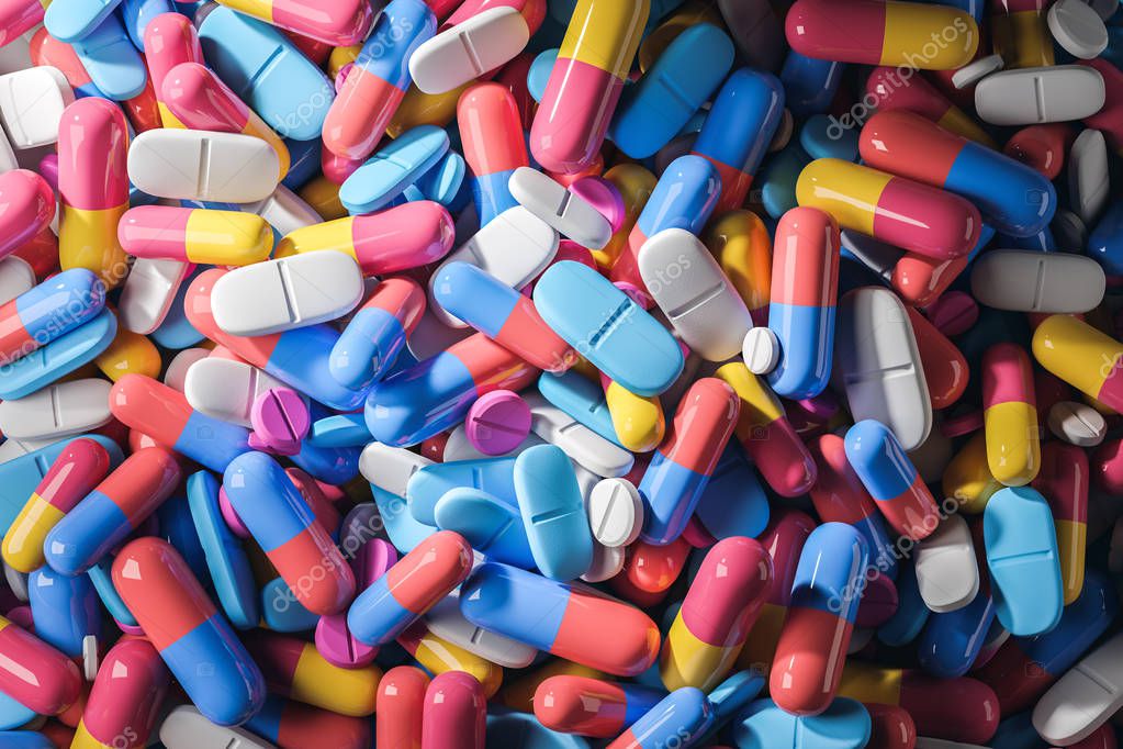 Pastillas de colores brillantes que yacen sobre una superficie plana ...