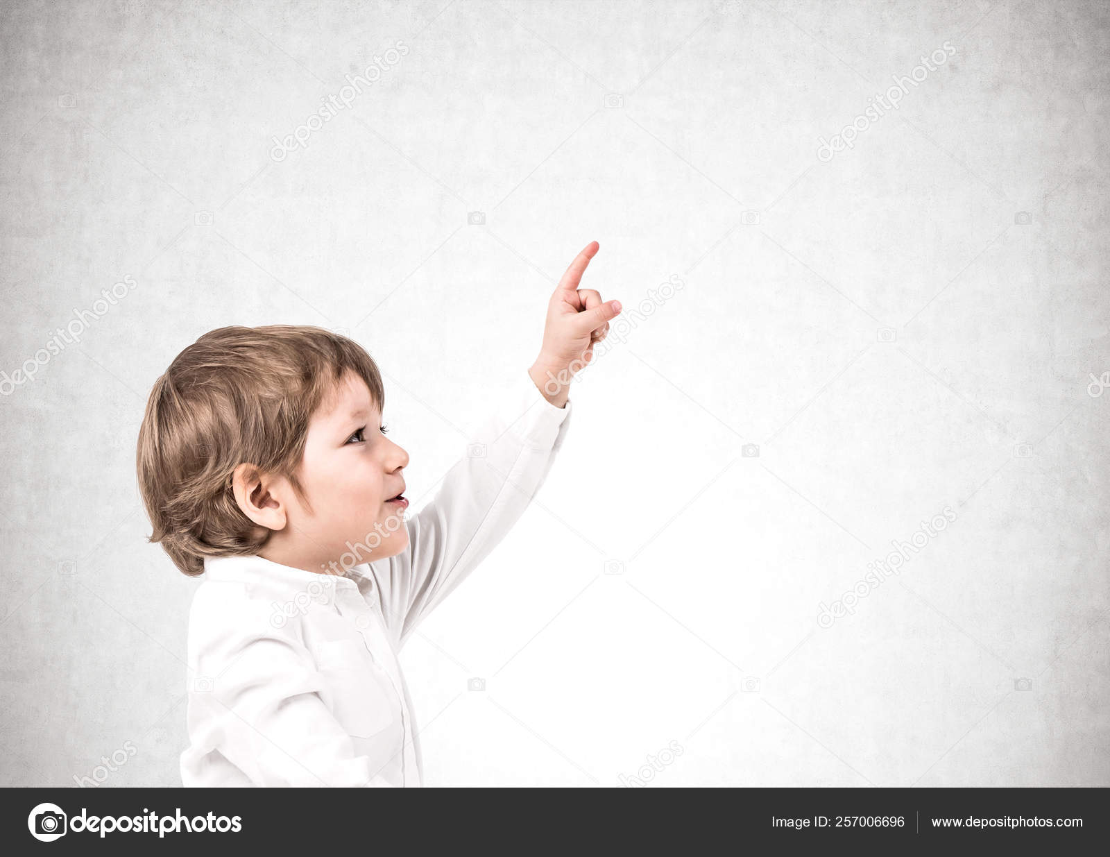 Adorable little boy pointing up — Stock Photo © denisismagilov #257006696