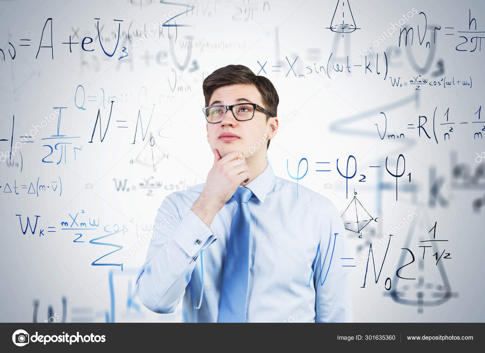 Thoughtful young man in glasses, formulas — Stock Photo ...