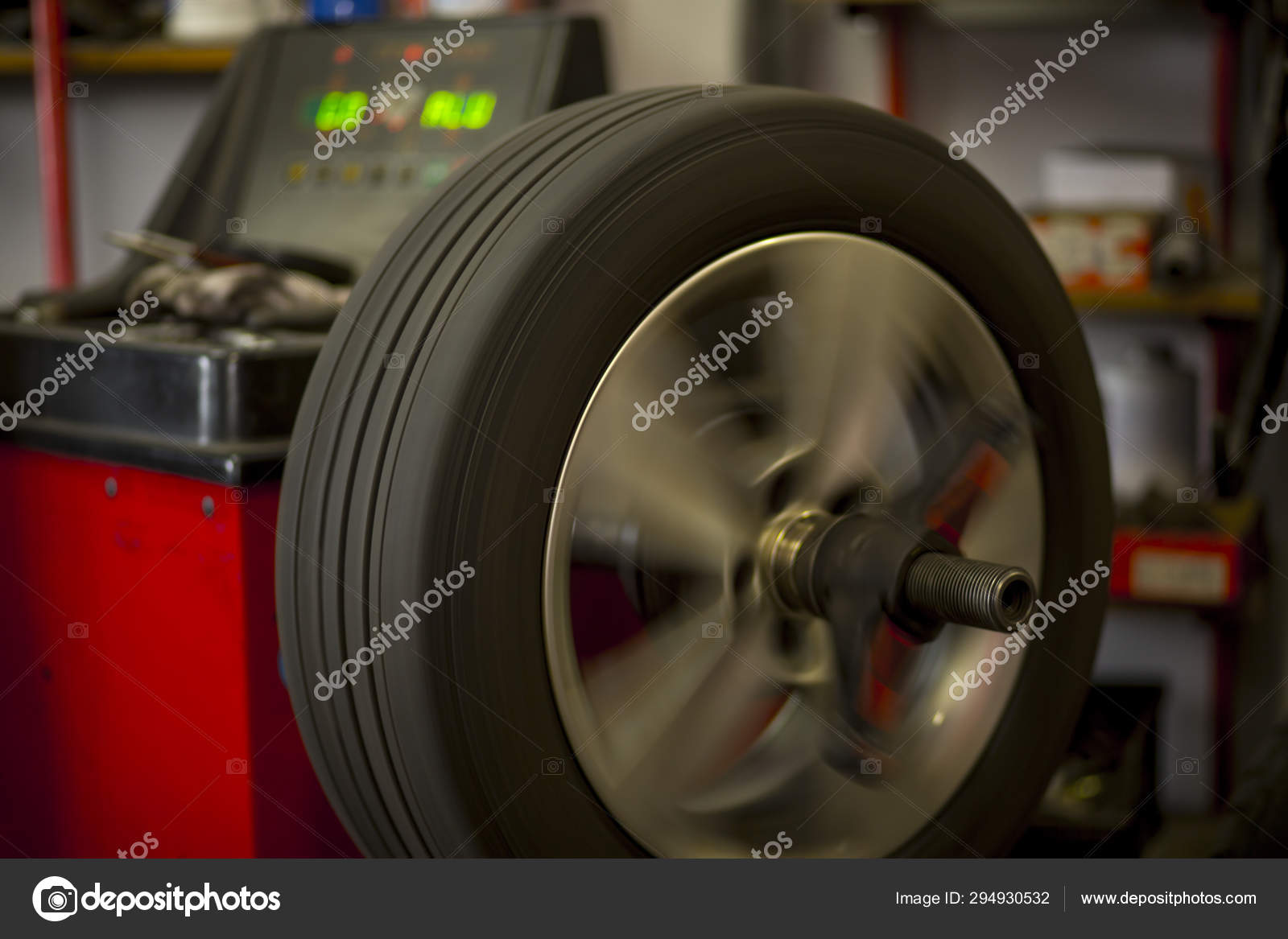 Spinning wheel with screen in background. Changing tires. Stock Photo ...