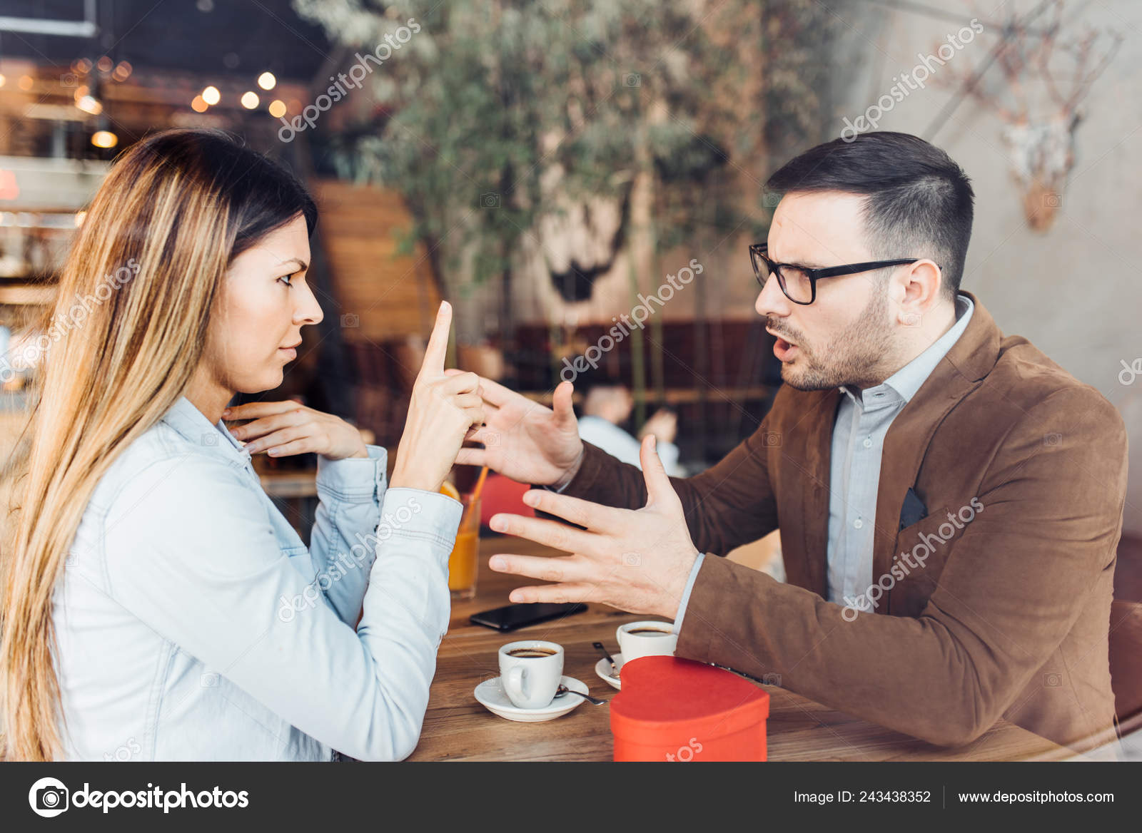 Young Couple Arguing While Sitting Drinking Coffee Restaurant Stock ...