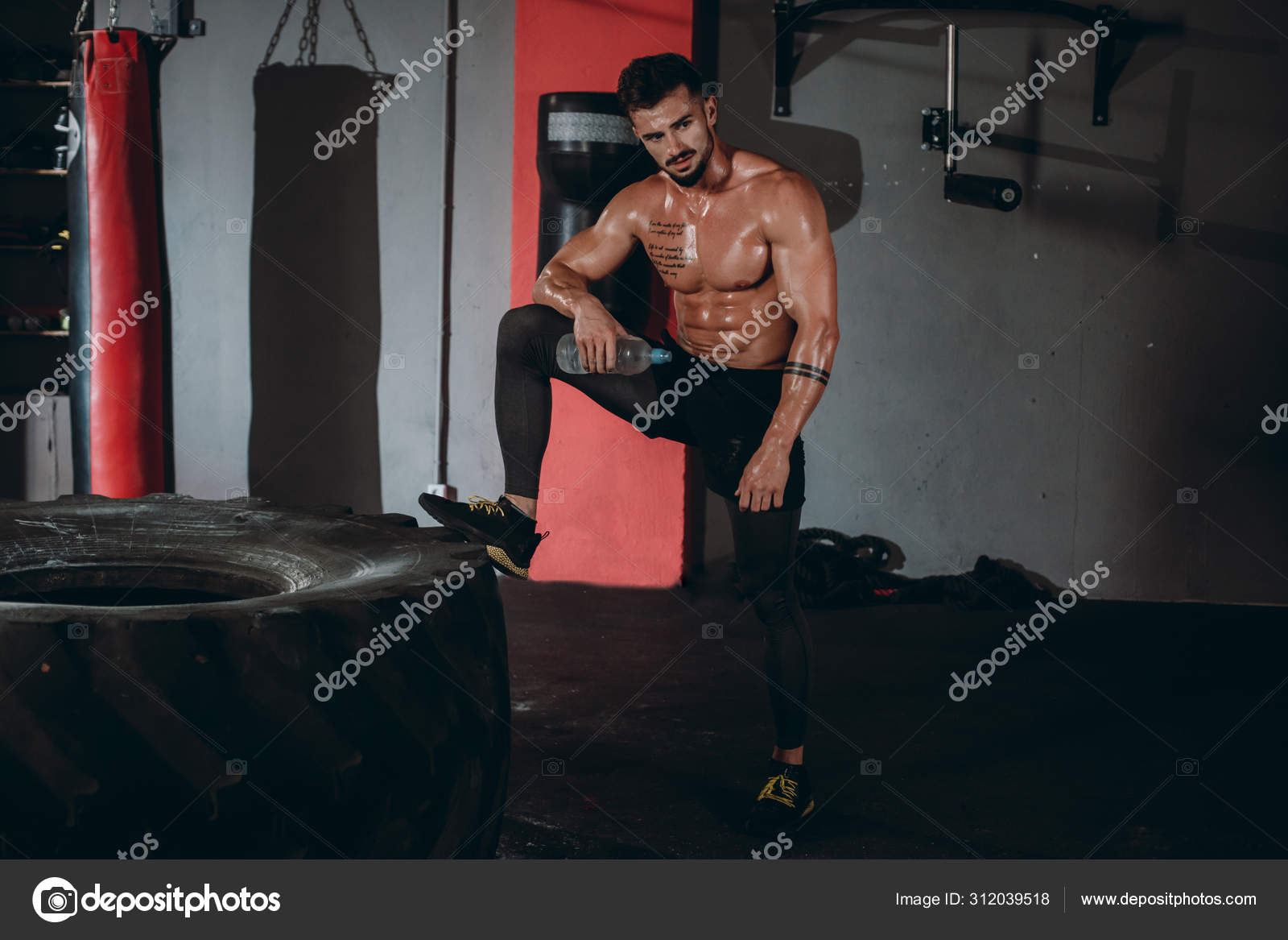 Professional bodybuilding man posing in front of the camera showing his ...
