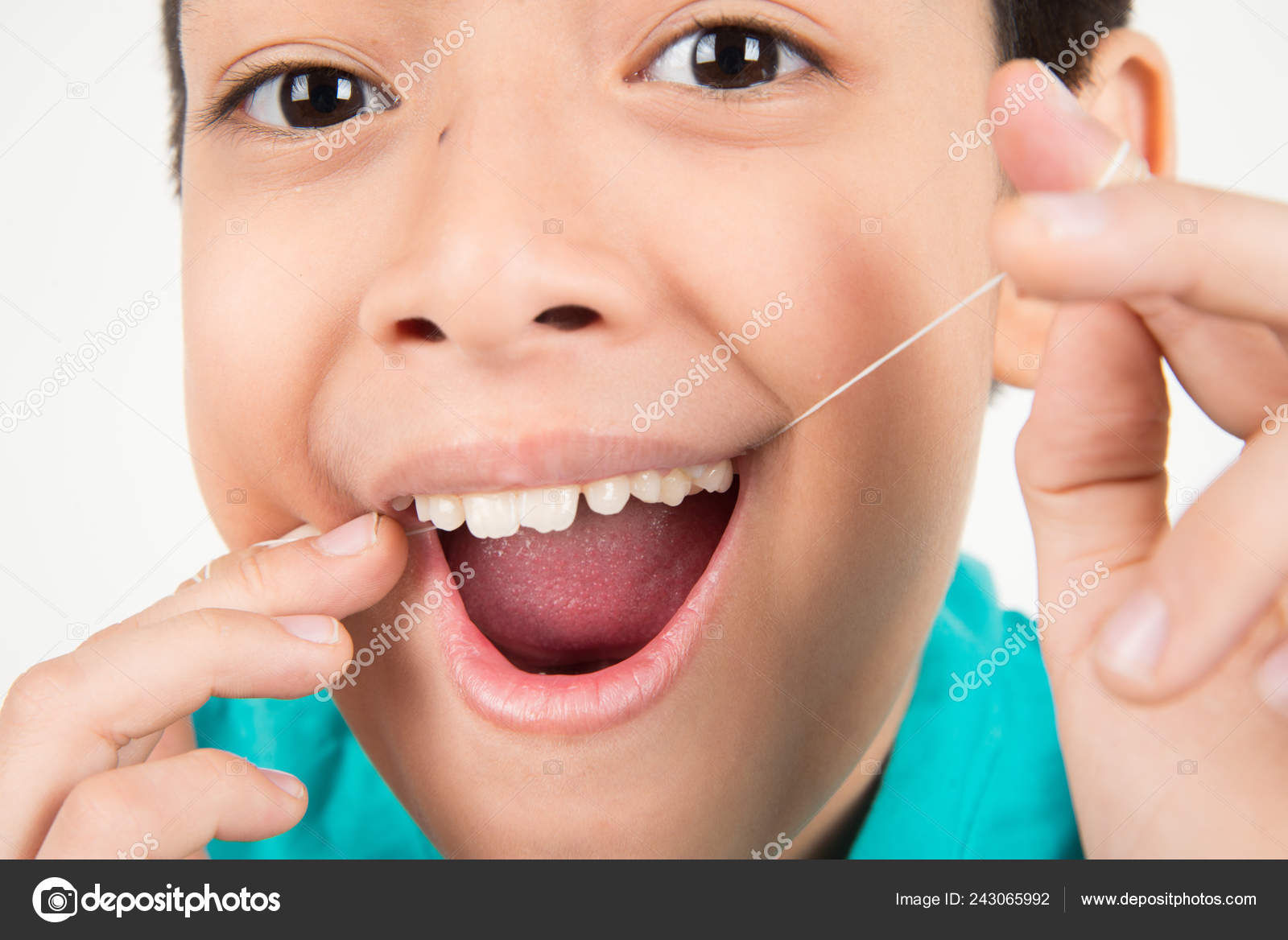 Boy Flossing Teeth