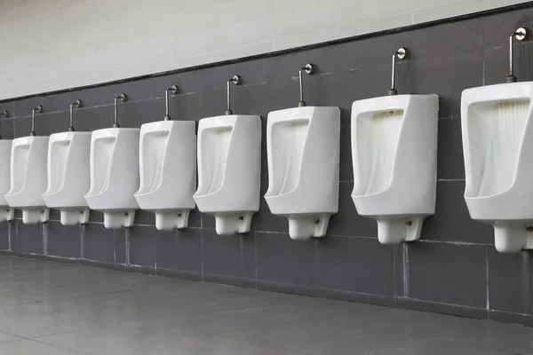 Male public toilet urinals Stock Photos, Royalty Free Male public ...