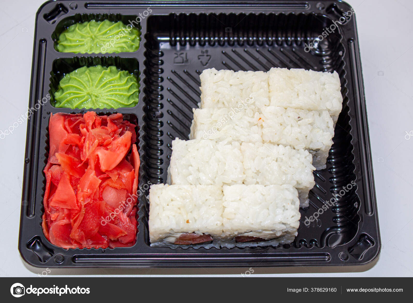 Sushi box. Japan menu in black transport box or bento box on gray ...