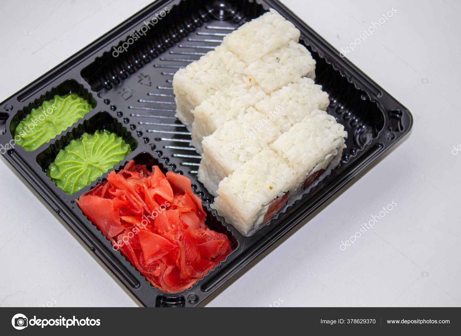 Sushi box. Japan menu in black transport box or bento box on gray ...