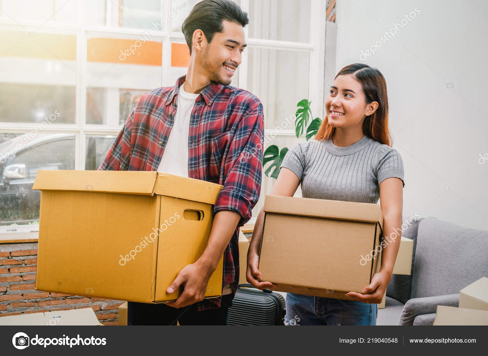 Asian Young Couple Carrying Big Cardboard Box Moving New House Stock