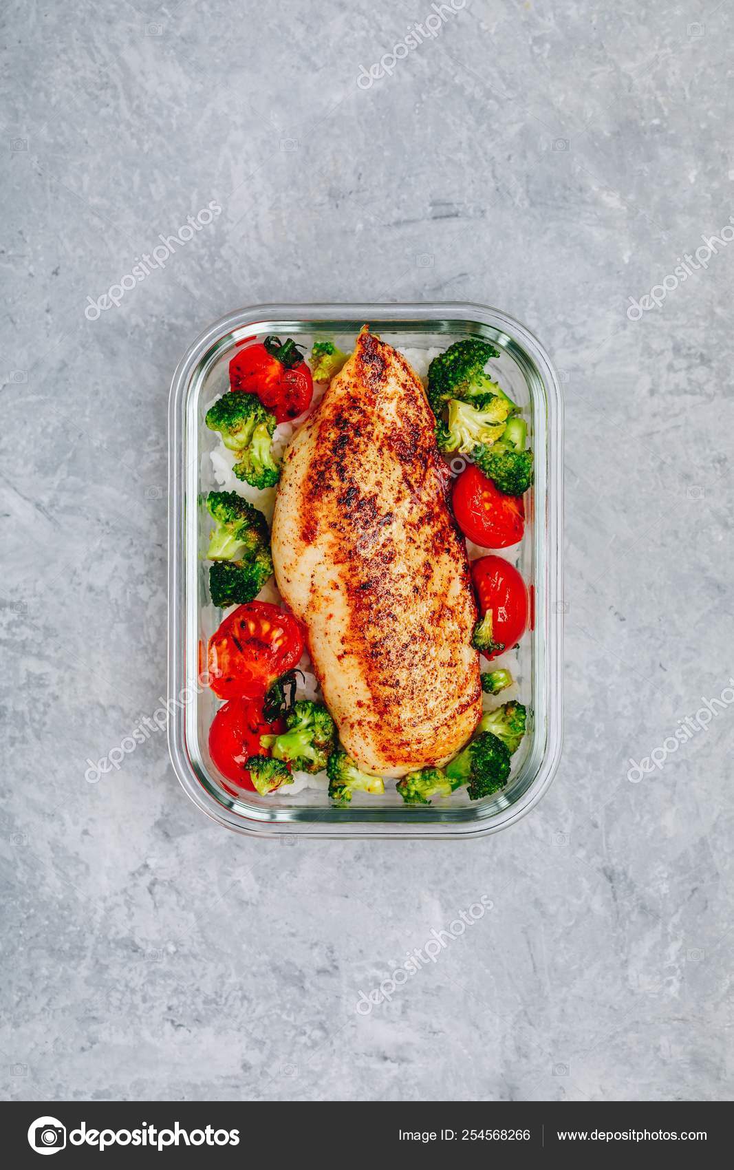 Grilled chicken meal prep containers with rice, broccoli and tomatoes ...
