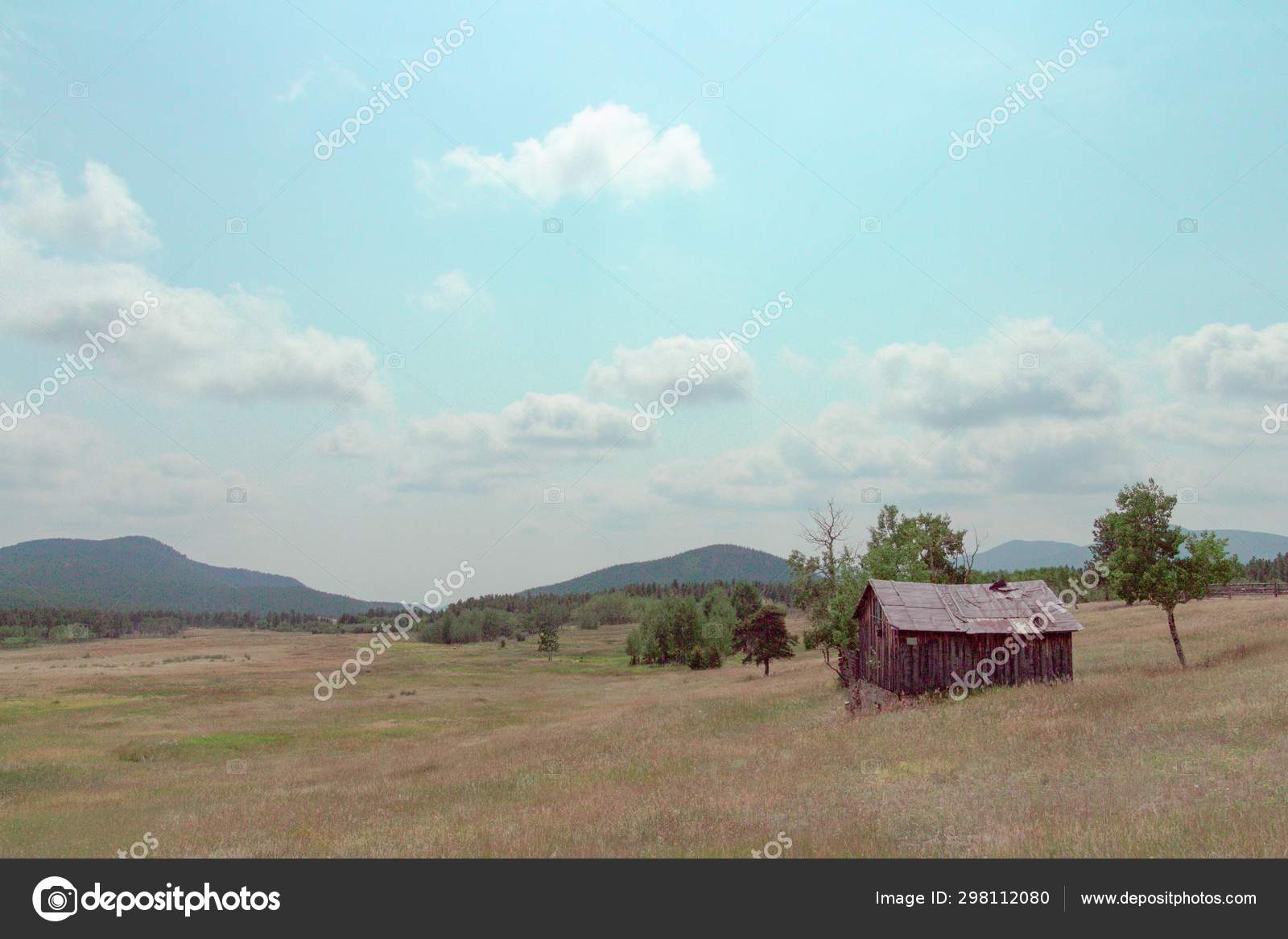 Small wooden barn built in a large field Stock Photo by ©Wirestock ...