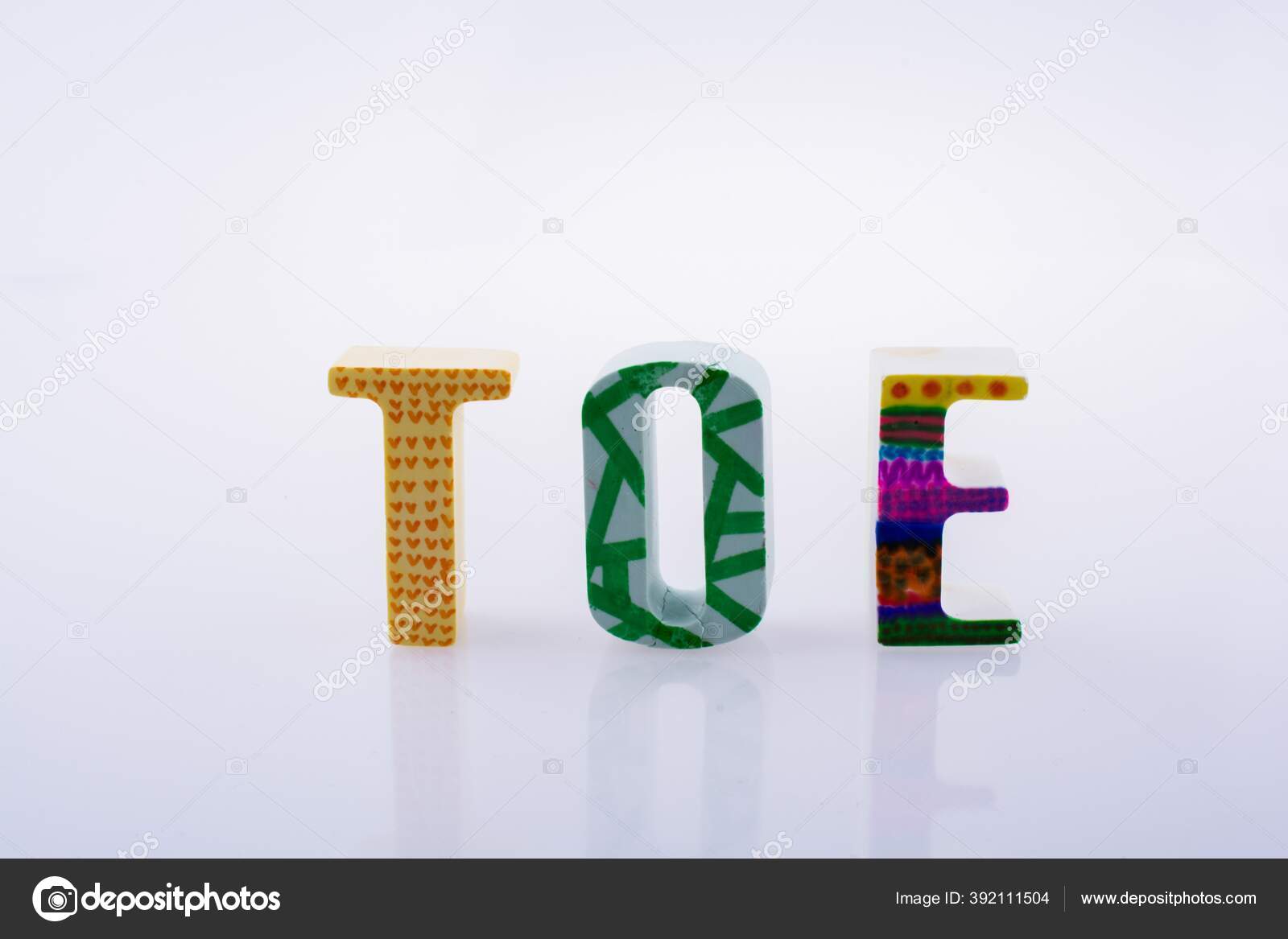 Colorful Letter Standees Spelling Word Toe White Background Stock Photo ...