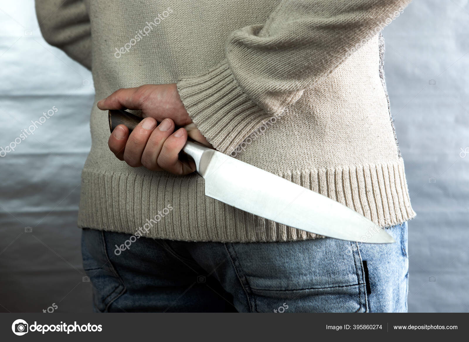 Man With Knife Behind Back