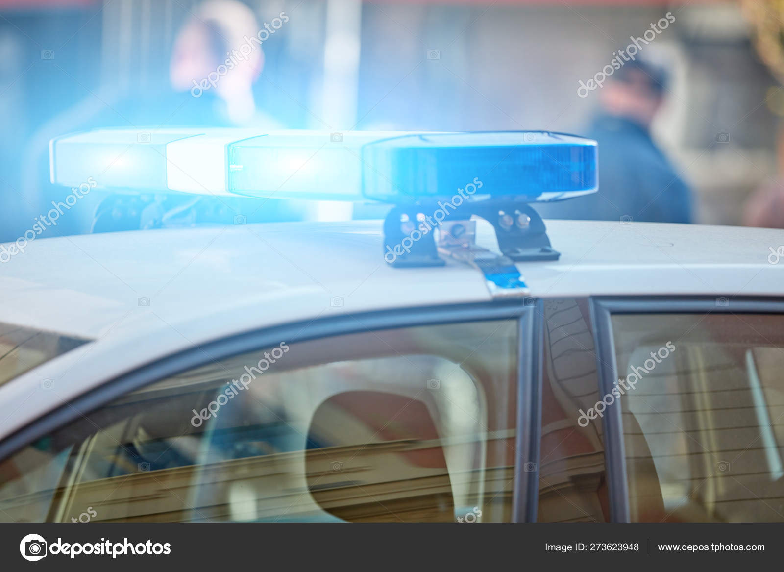 Police car with blue lights on the crime scene in traffic / urba ...