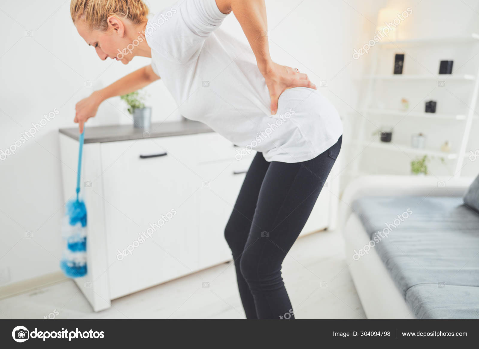Injury while cleaning the house and doing daily housework. Stock Photo ...
