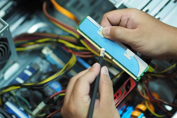 Cleaning a random access memory or RAM using an eraser - Stock Image ...
