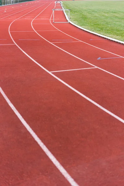 red rubber running track, outdoor sport floor - Stock Image - Everypixel