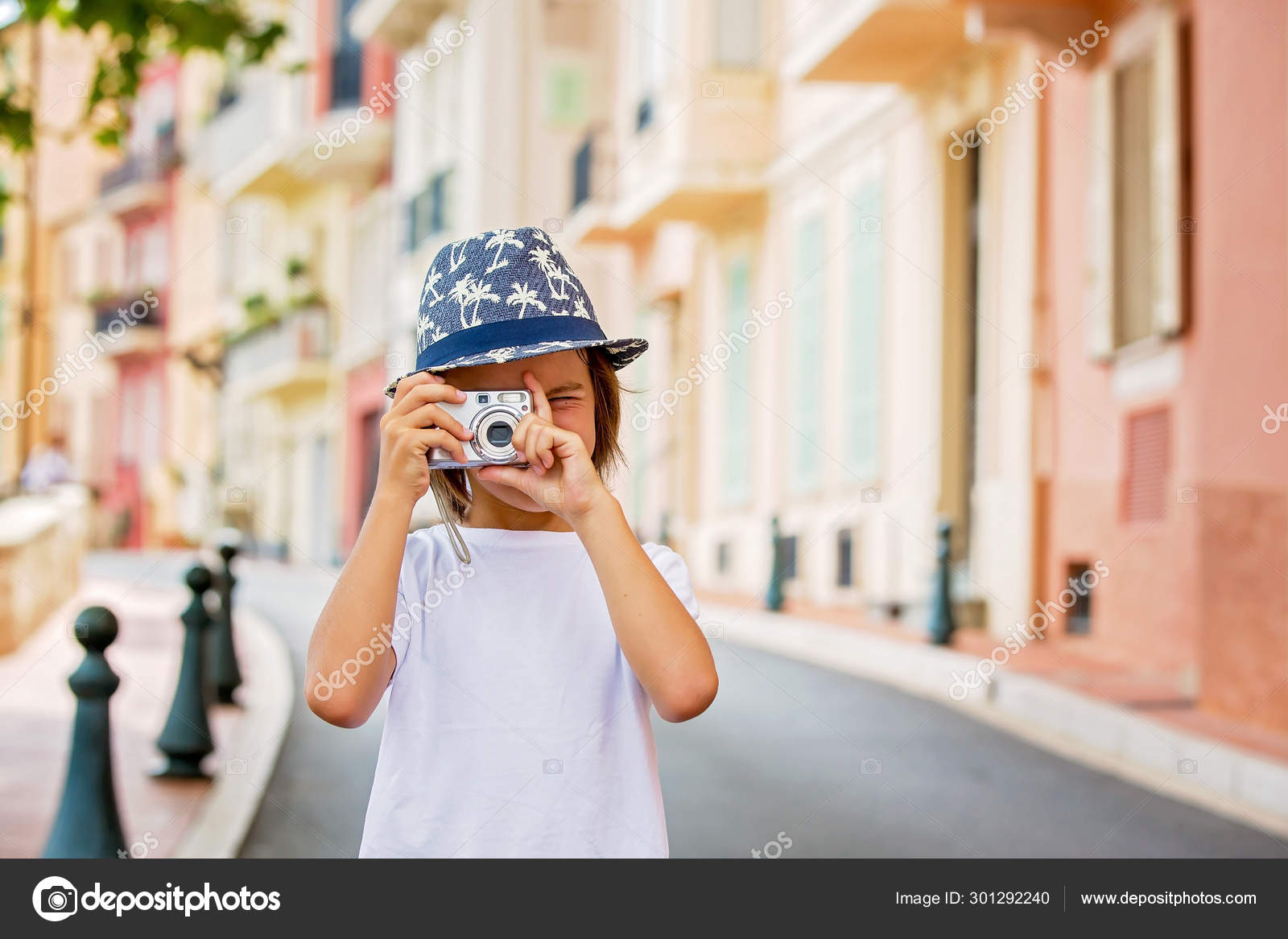 Children taking pictures on a narrow street with houses in Monac Stock ...
