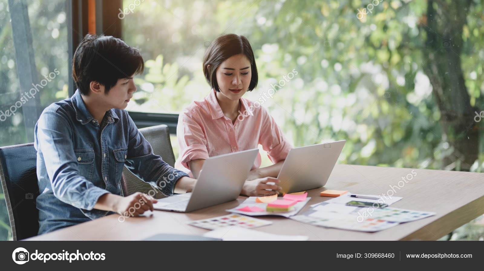 Team of UI web developer working on their project on smartphone Stock ...