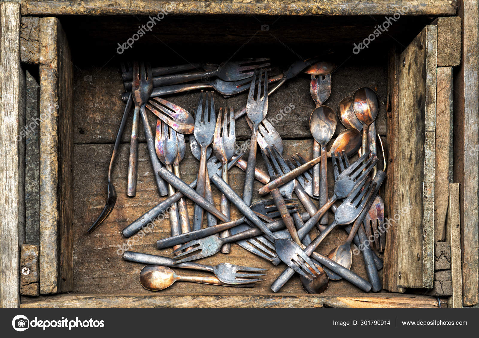 Work in process of handmade broze cutlery of spoons and forks in ...