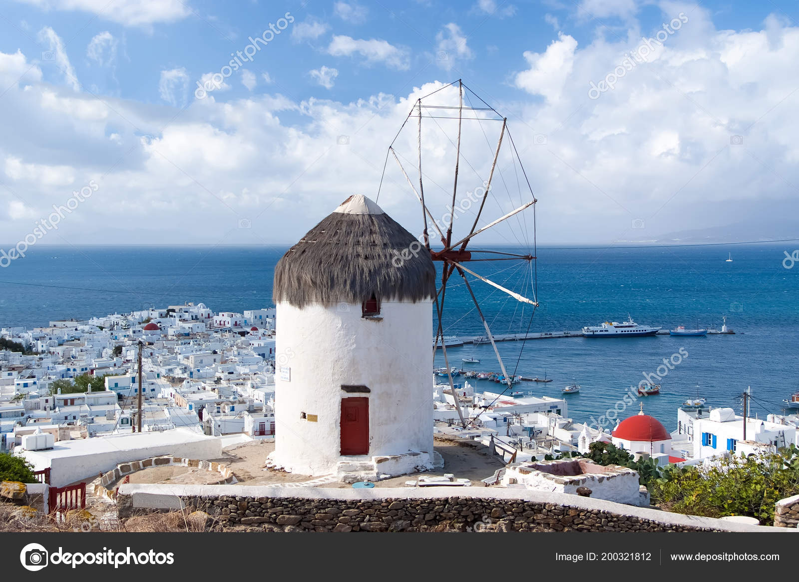 Windmill on mountain by sea in Mykonos, Greece. Windmill on seascape on ...