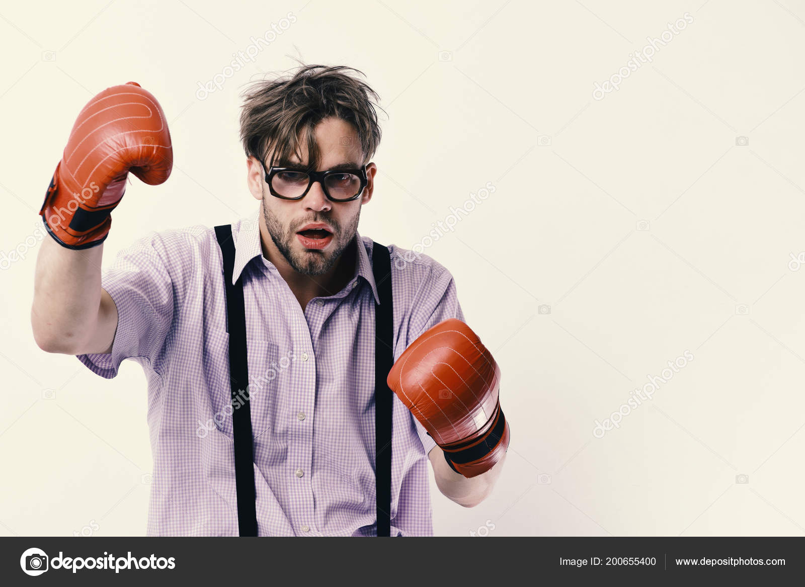 Weak guy makes hits and punches. Man with bristle and dull face wears ...