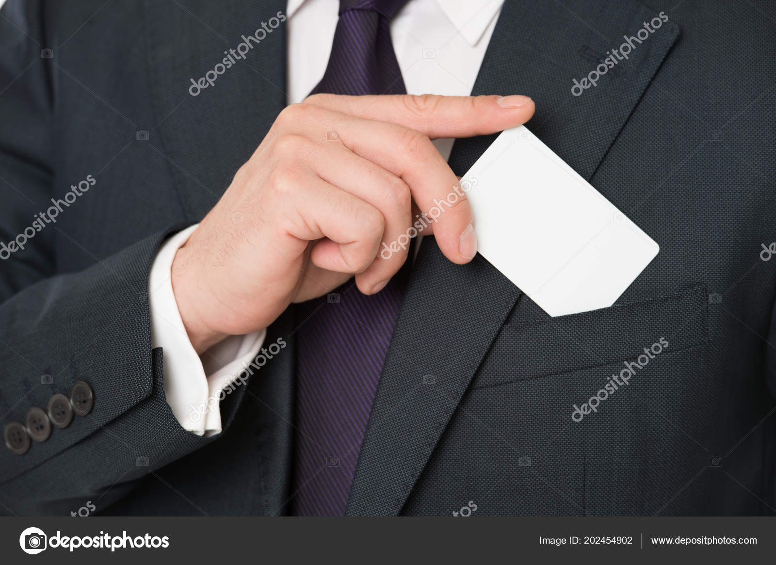 Custom debit card design. Male hand put plastic blank white card to ...