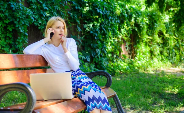 Call sales techniques. Sales manager works in park. Woman with laptop ...