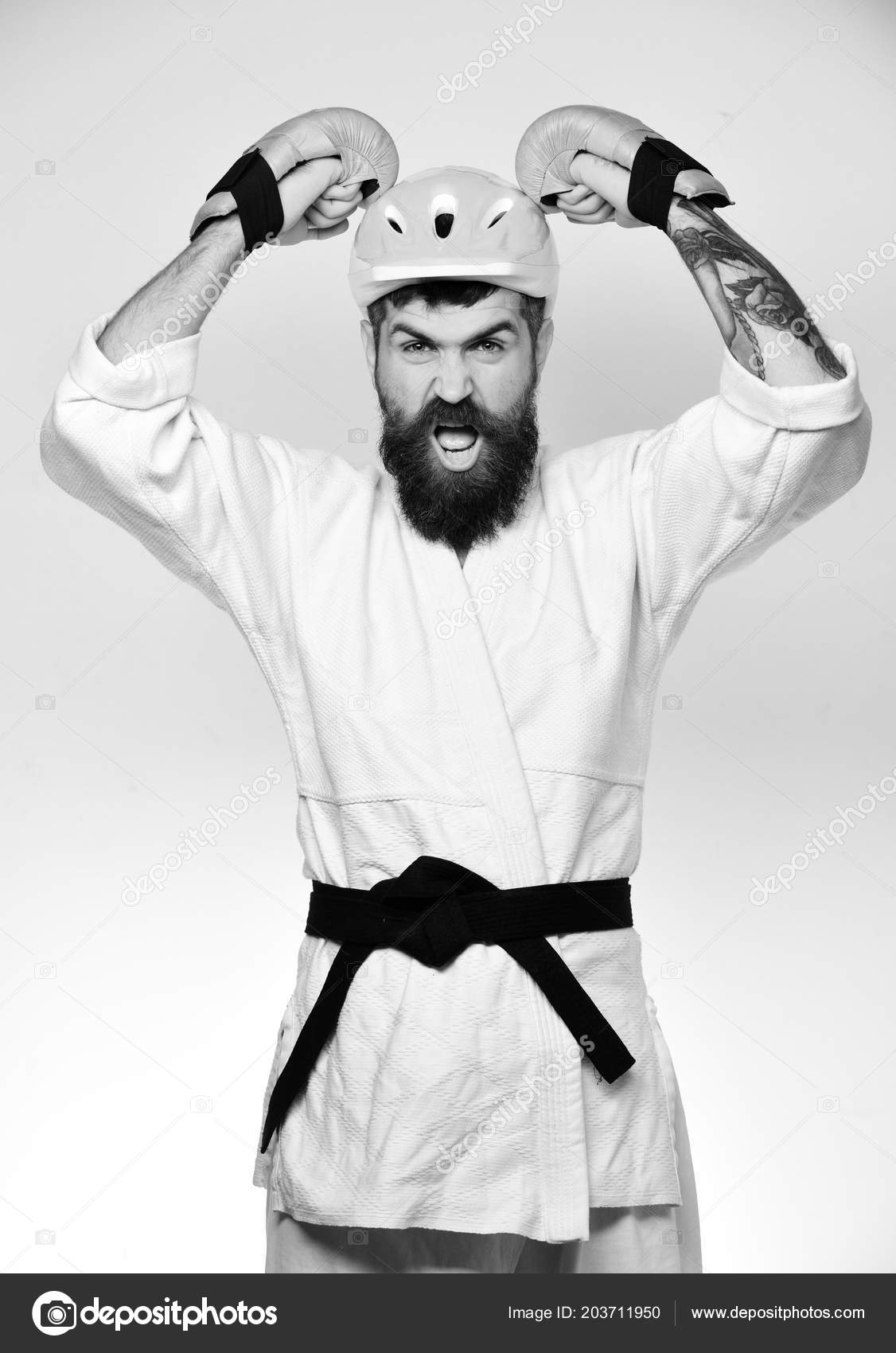 Martial arts. Man with beard in kimono and pink helmet Stock Photo by ...