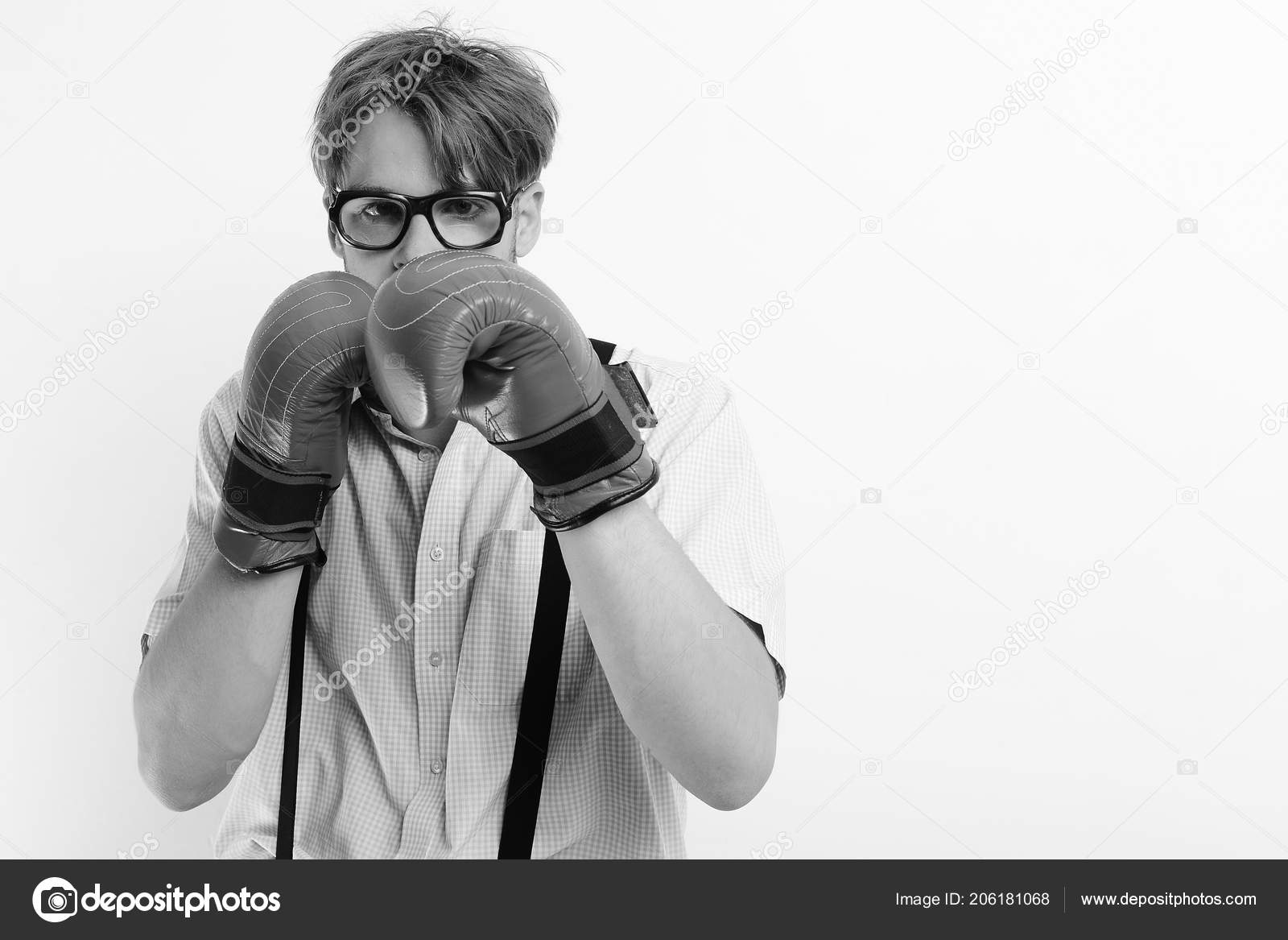 Weak guy makes hits and punches. Nerd with leather box equipment ...