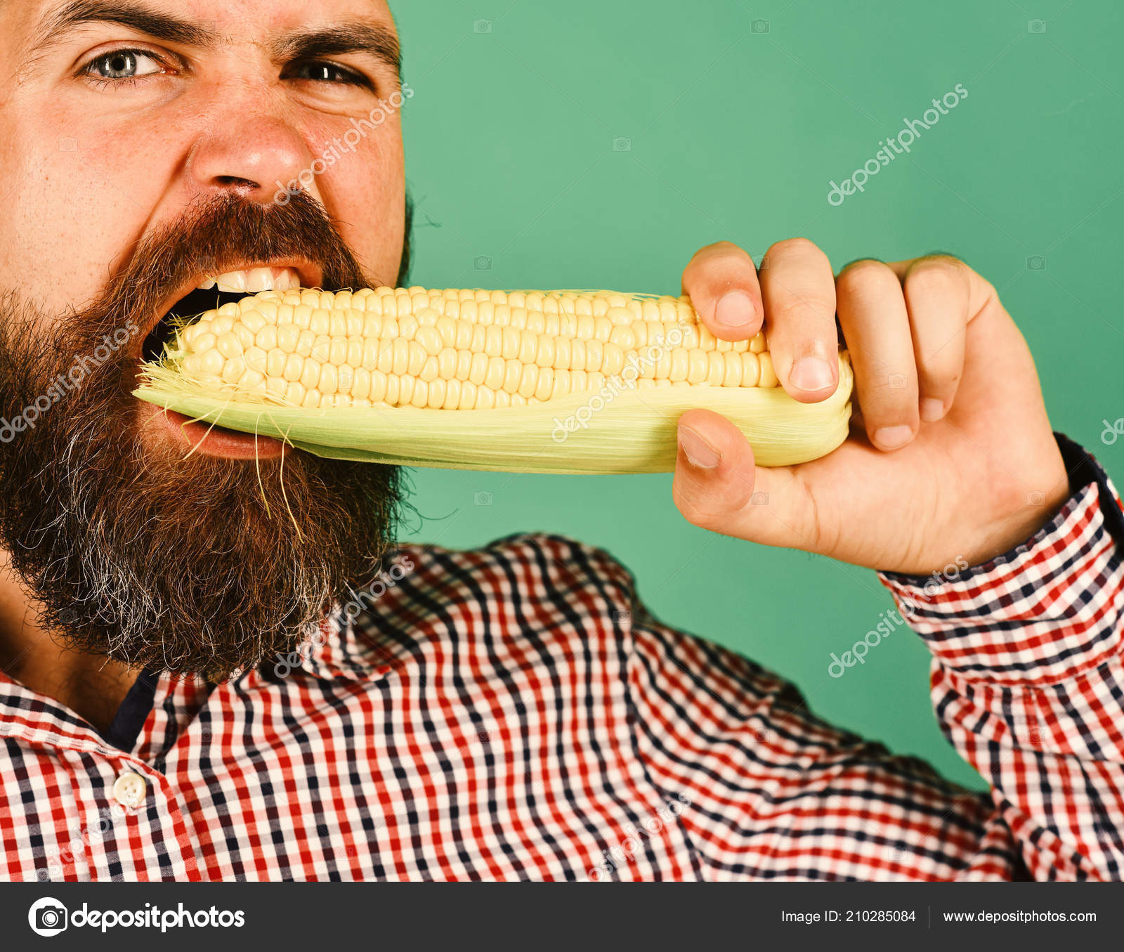 Man Eating Corn On The Cob