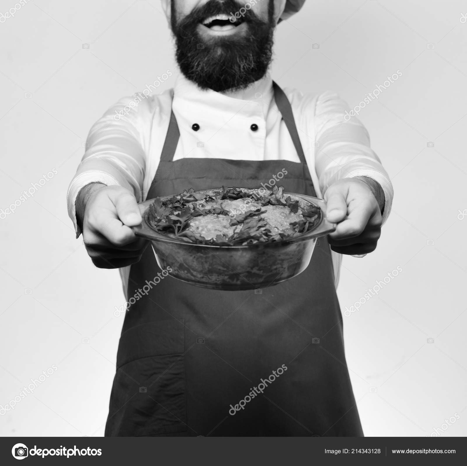 Chef cook in uniform handing a bowl with potato dish Stock Photo by ...