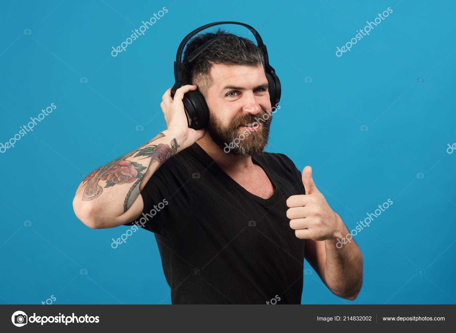 Singer with beard and smiling face enjoys music. Stock Photo by ...