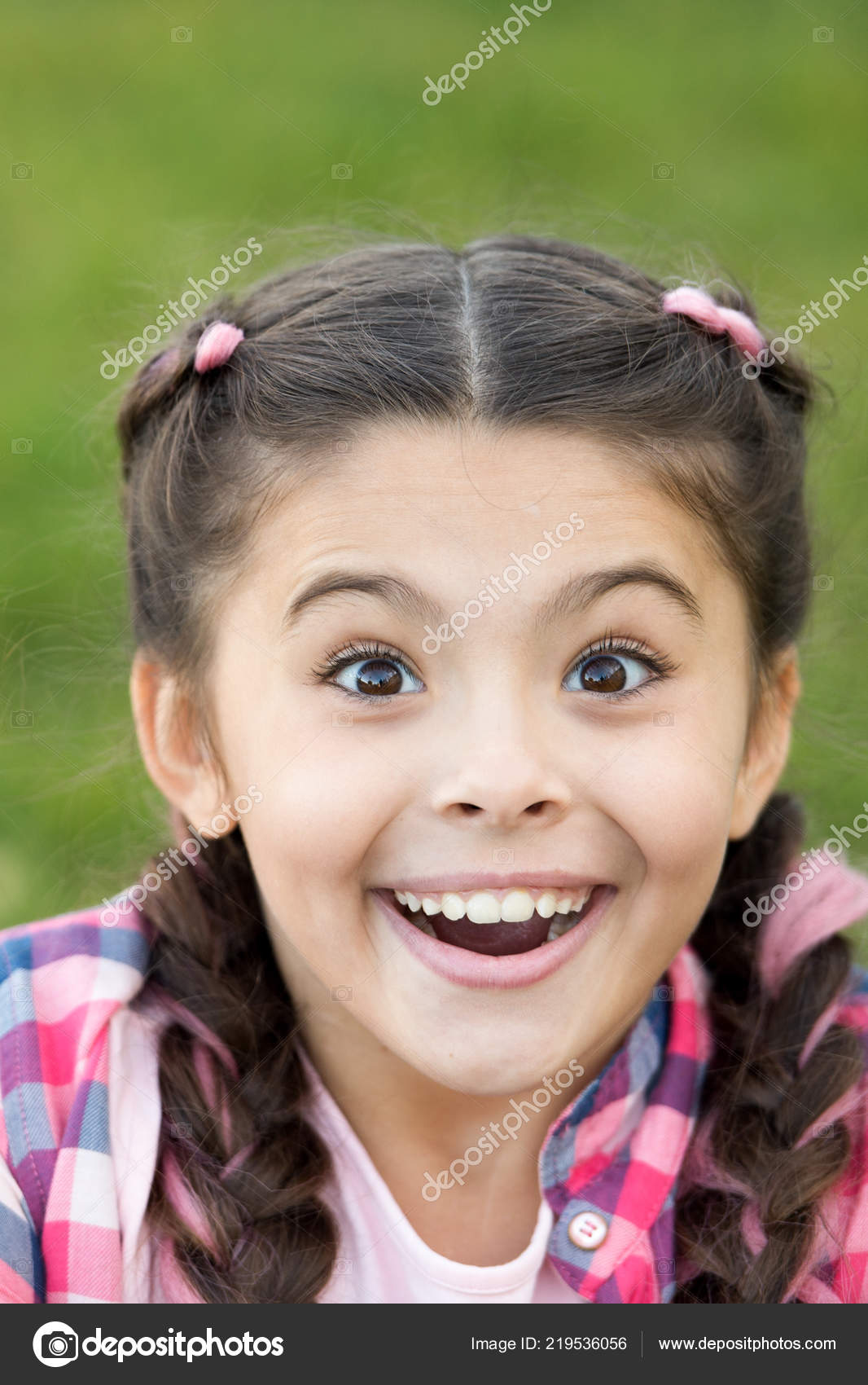 Cute surprised girl with smile on her face. Expression of happiness ...