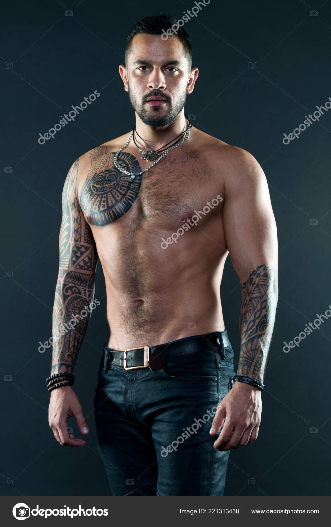 Muscular tattooed athlete look attractive. Sport and fashion concept ...