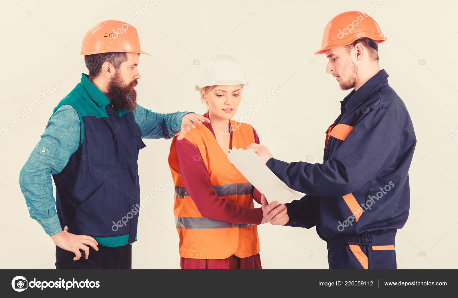 Men in hard hats, uniform and woman. Teamwork problems Stock Photo by ...