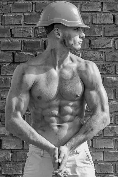 Unhappy bodybuilder wear casual undershirt with jeans showing strong ...