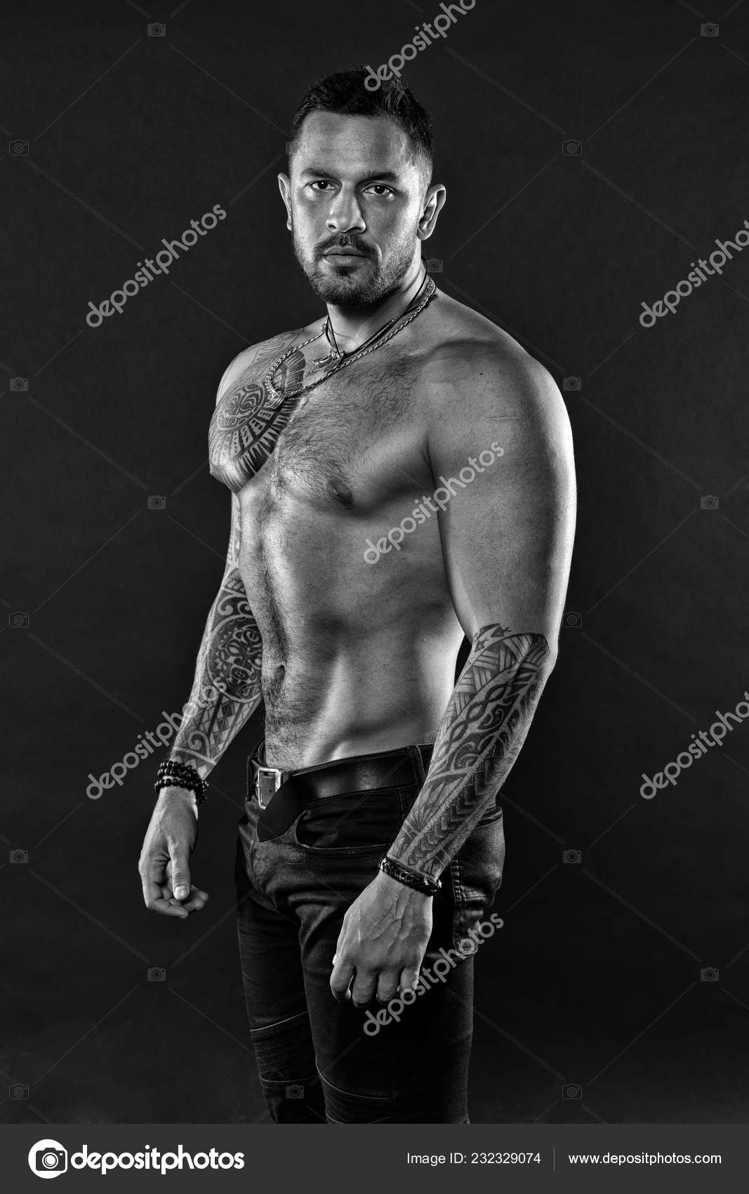 Bearded man show tattooed torso. Brutal strict macho with tattoos ...