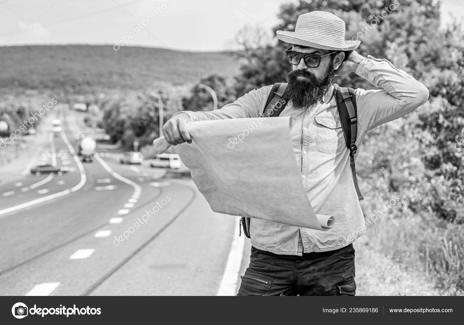 Carry good map. Tourist backpacker looks at map choosing travel ...